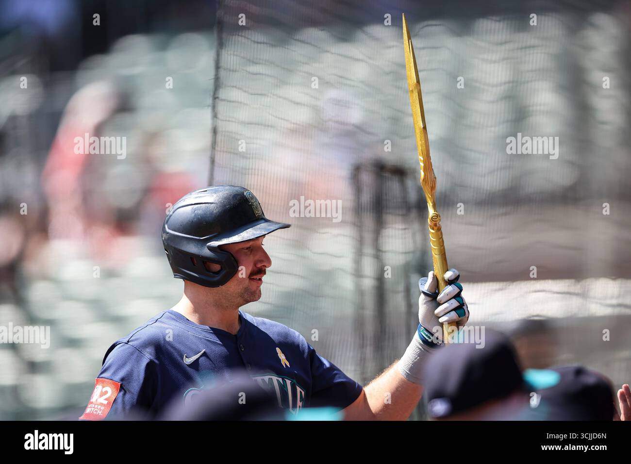 Seattle Mariners' Cal Raleigh hoists the celebratory trident after ...