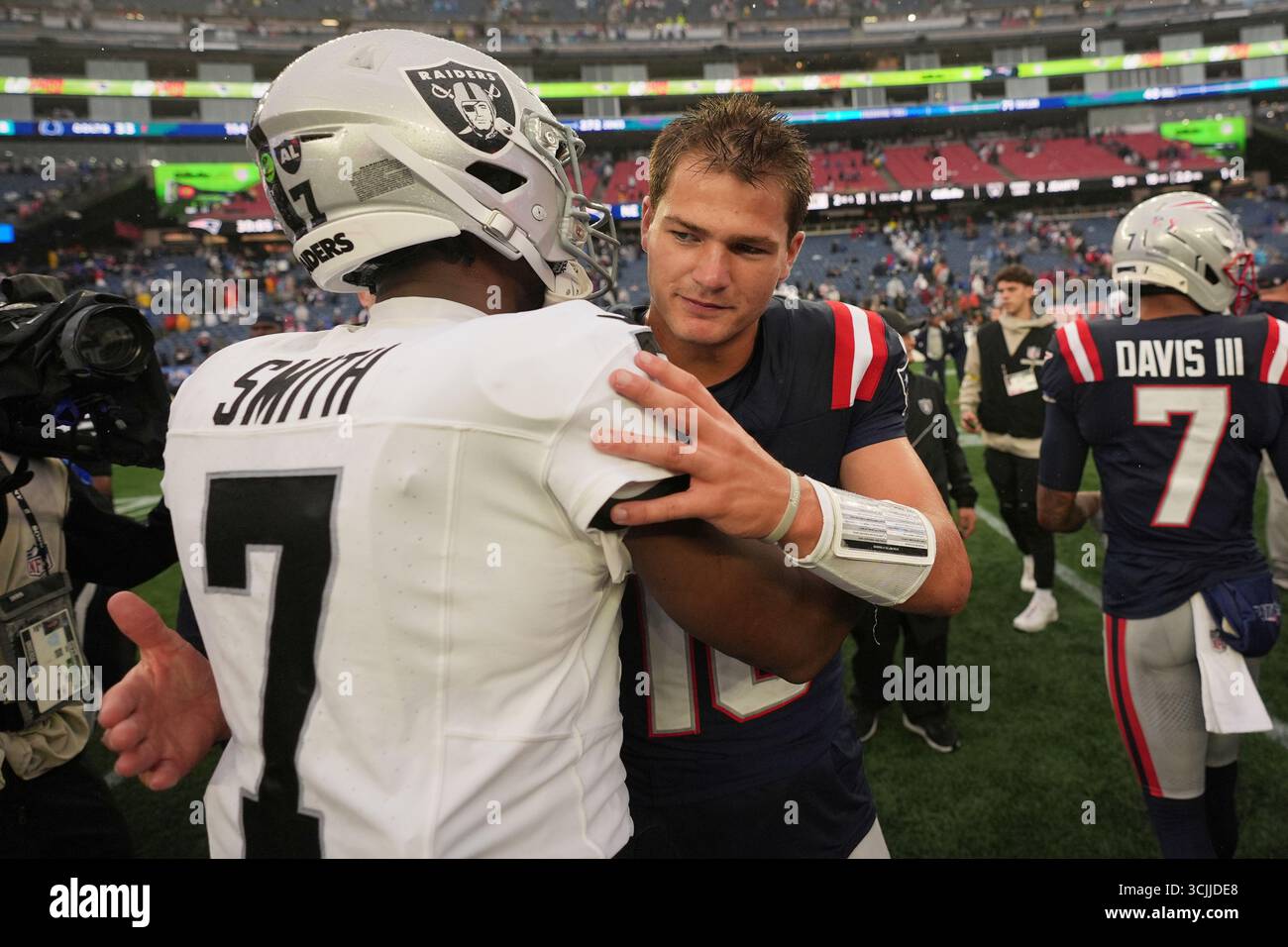 Las Vegas Raiders quarterback Geno Smith (7) embraces New England ...