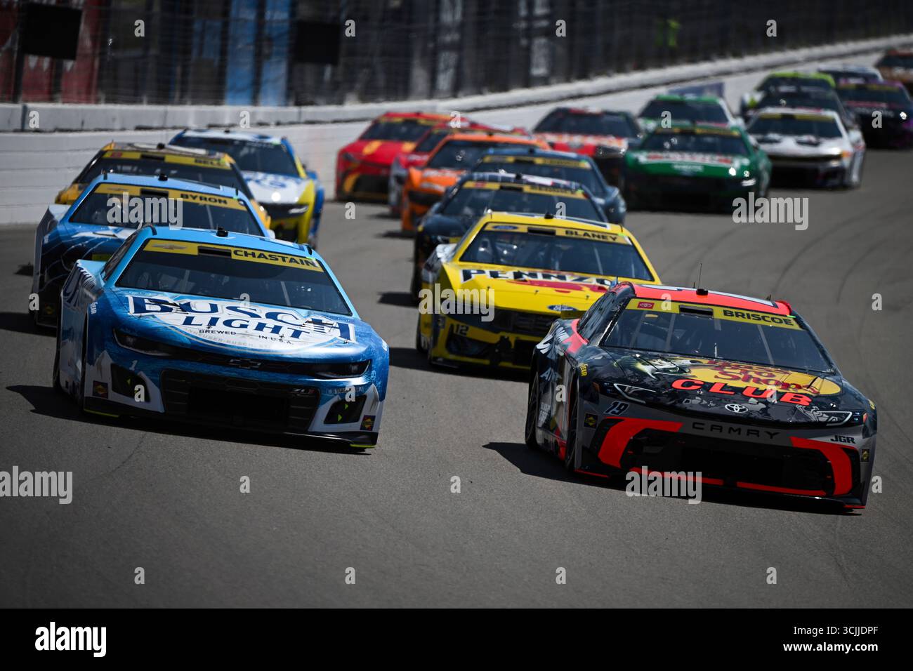 Ross Chastain (1) and Chase Briscoe (19) compete during a NASCAR Cup ...