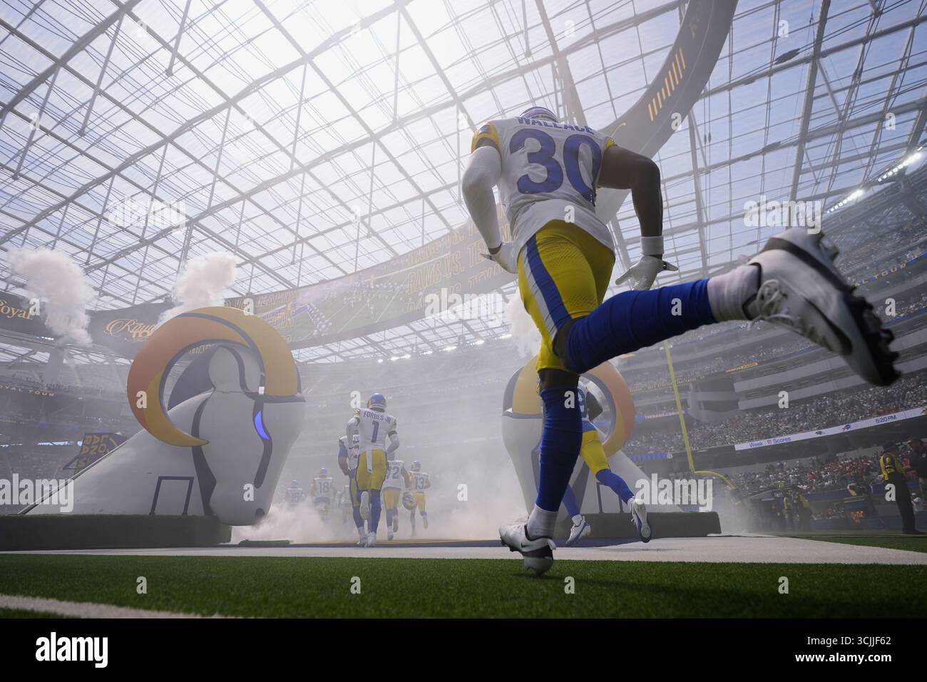 Los Angeles Rams cornerback Josh Wallace (30) and teammates run onto ...