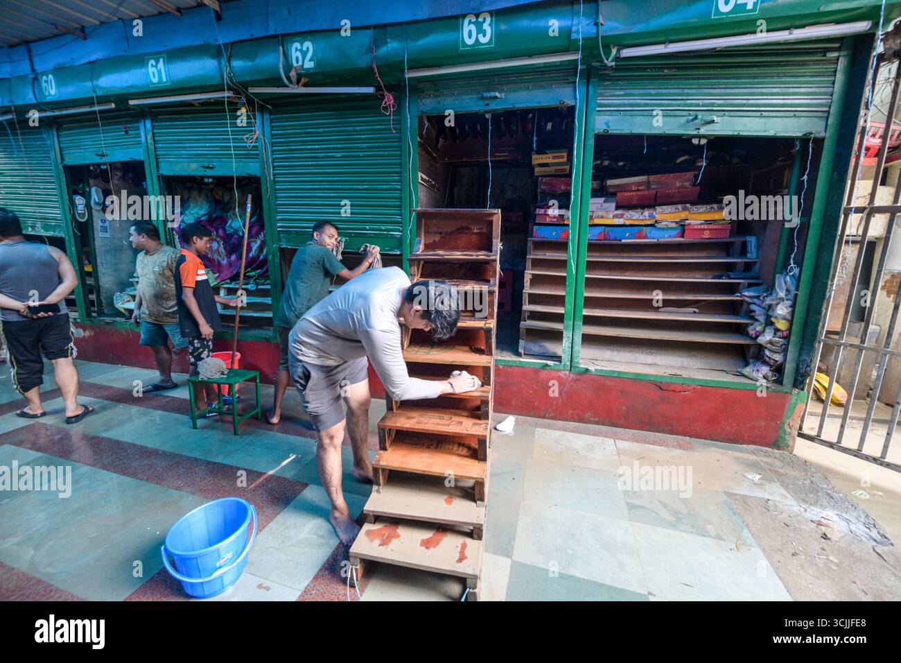 NEW DELHI, INDIA - SEPTEMBER 6: Local people clean the Tibetan refugee ...