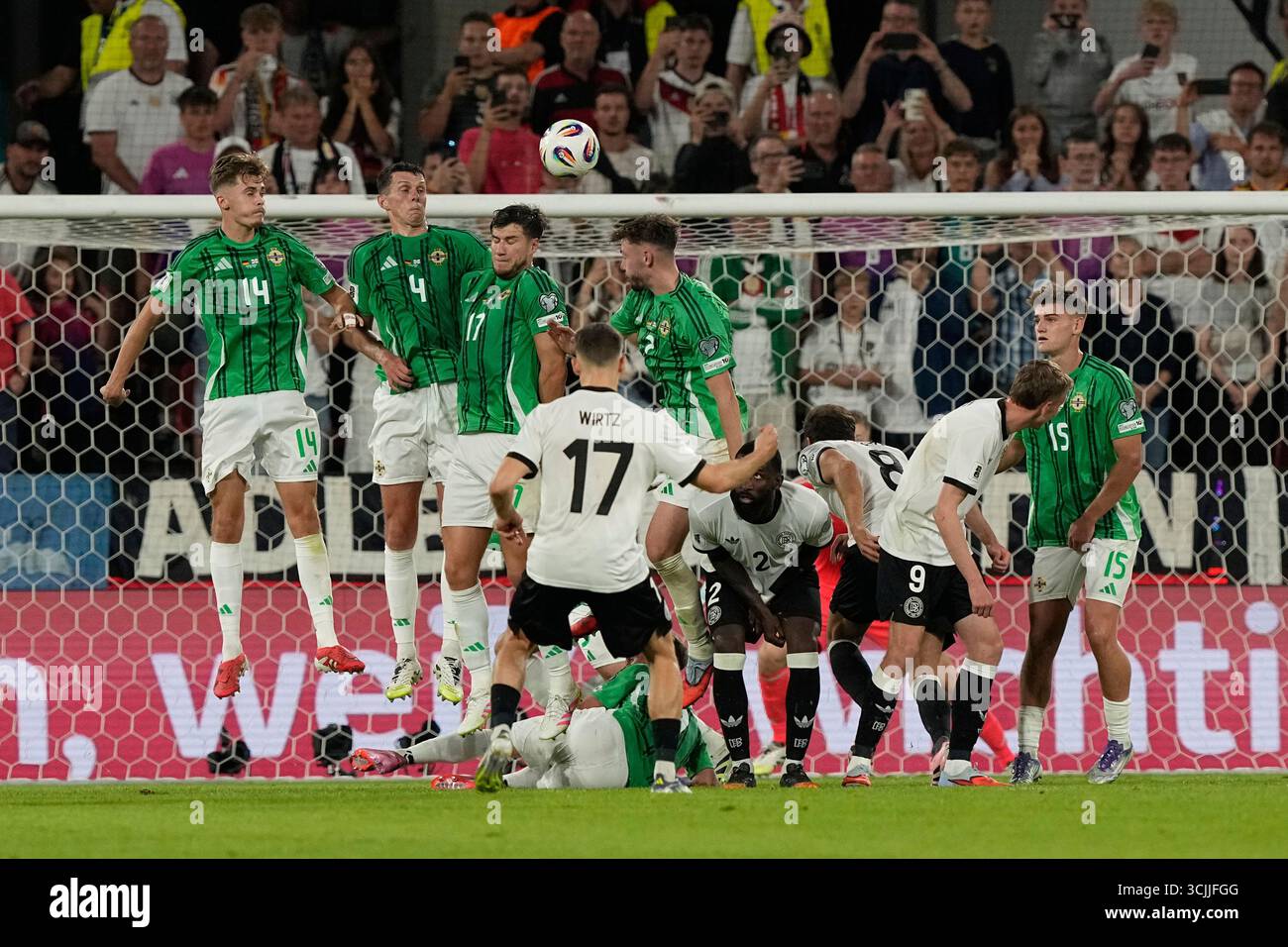 Germany's Florian Wirtz (17) scores his side's third goal during the ...