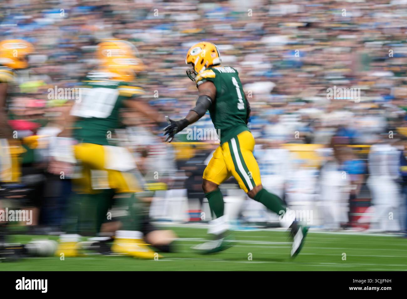Green Bay Packers defensive end Micah Parsons (1) runs onto the field ...