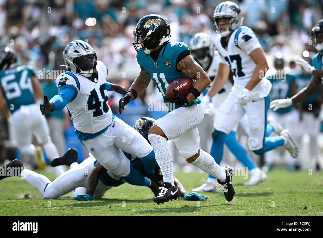 Jacksonville Jaguars wide receiver Parker Washington (11) returns a ...