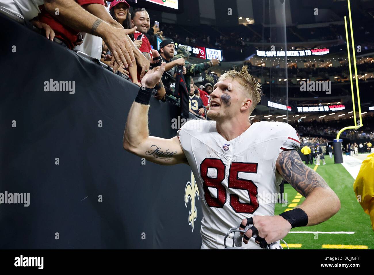 Arizona Cardinals tight end Trey McBride celebrates a win with ...