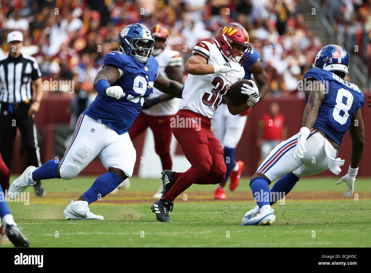 Washington Commanders running back Austin Ekeler (30) runs with the ...