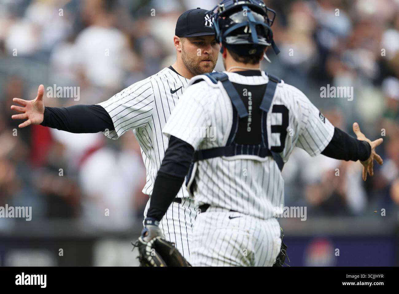 New York Yankees pitcher David Bednar, left, and catcher Austin Wells ...