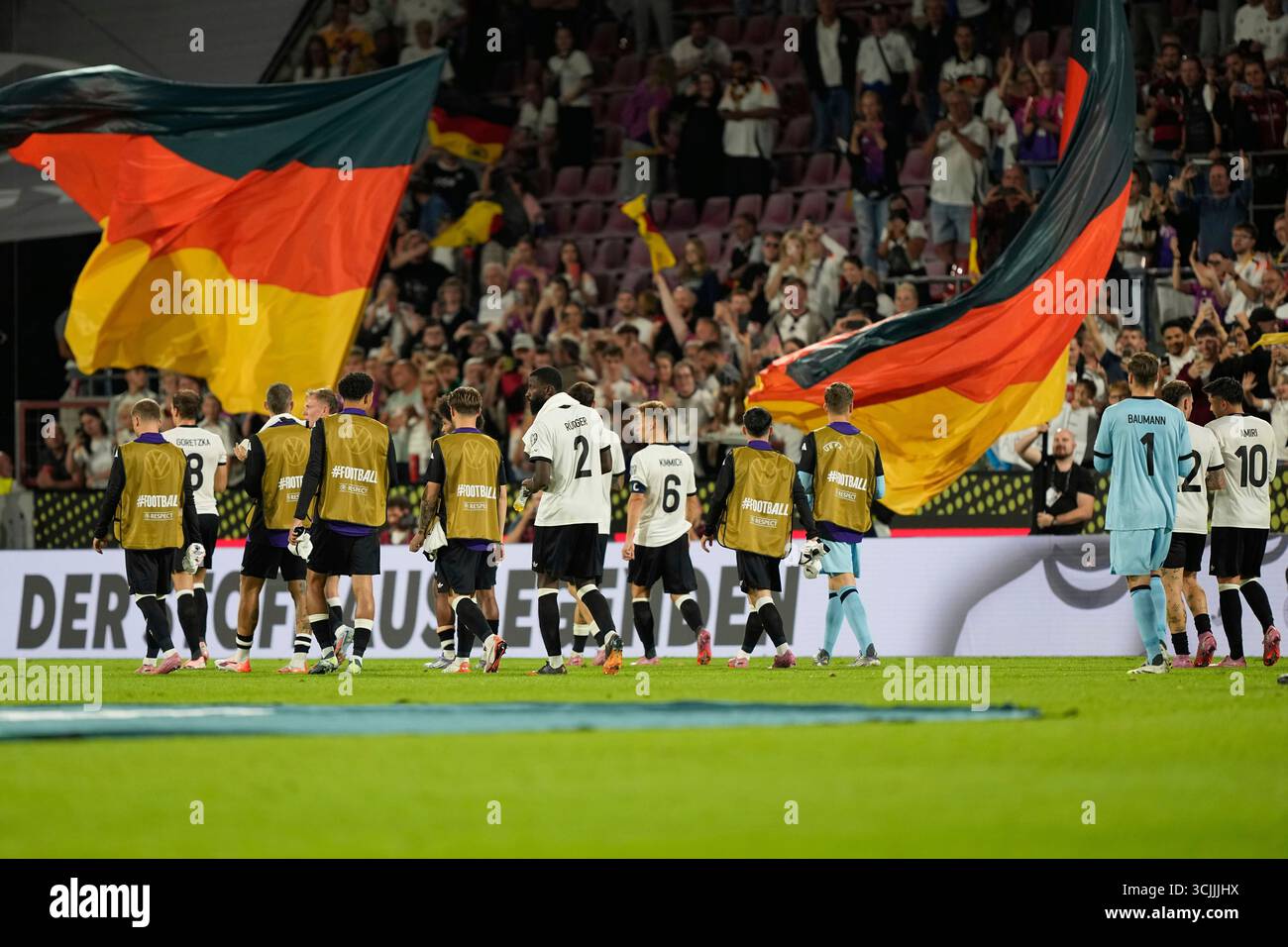 German players walk around the field to acknowledge the applause from ...
