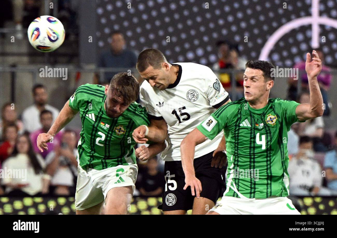 Germany's Waldemar Anton with Northern Ireland's Conor Bradley and Eoin ...