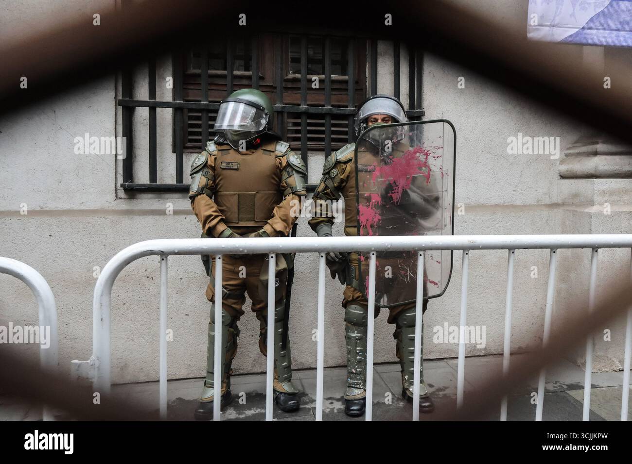 Santiago, Chile. 07th Sep, 2025. Two police officers protect the Moneda ...