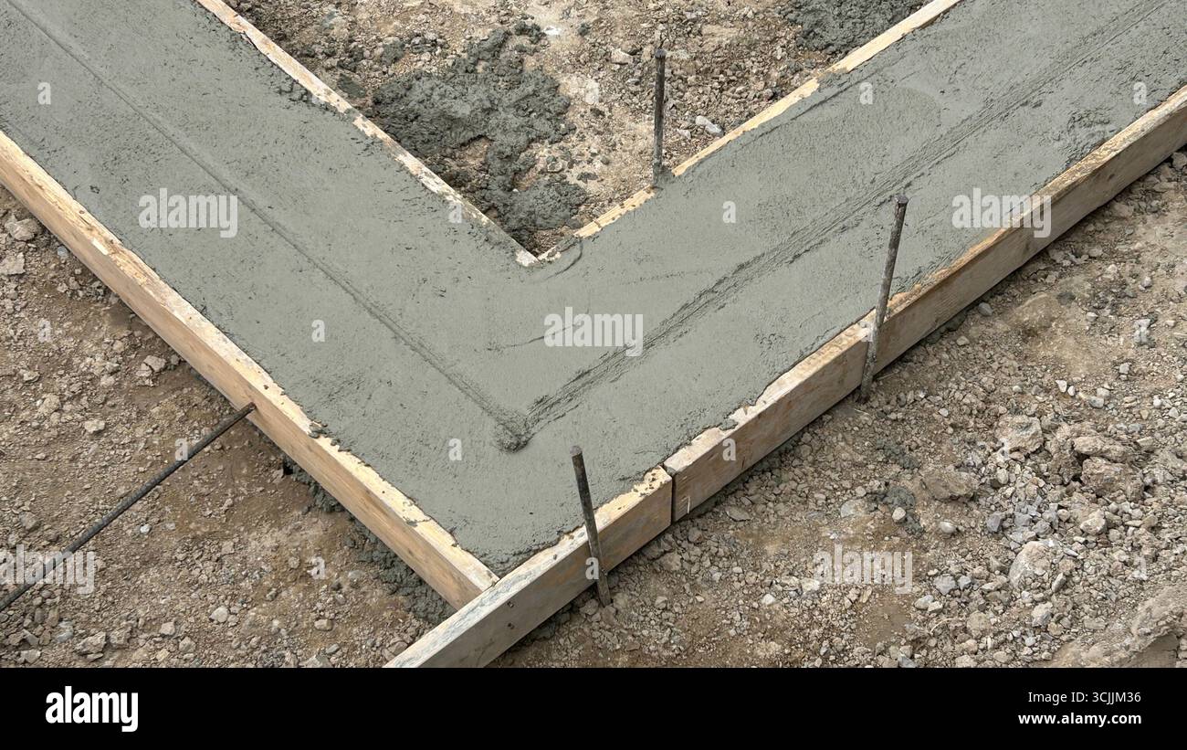 Pouring concrete residential development foundation hi-res stock ...