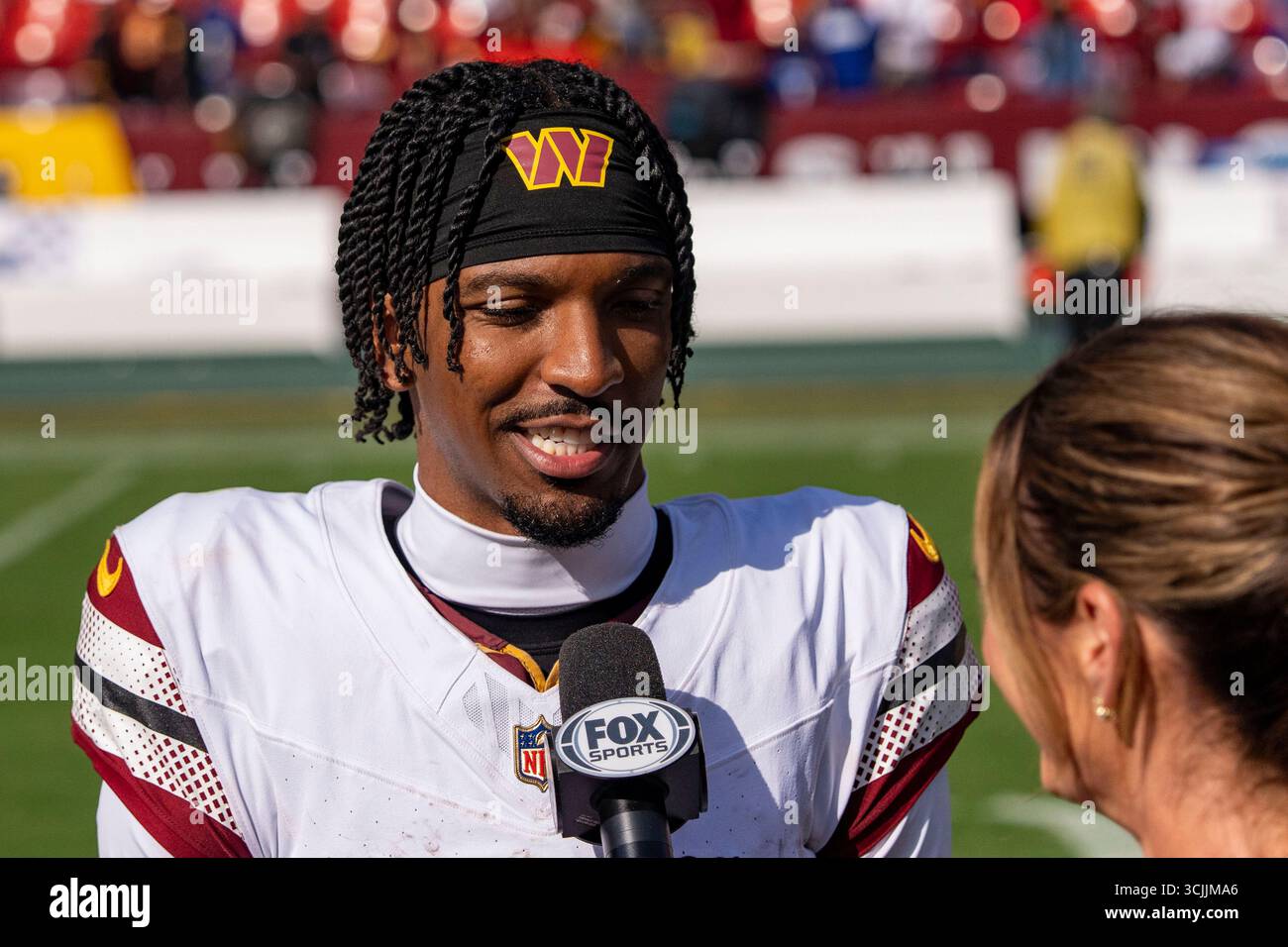 Washington Commanders quarterback Jayden Daniels (5) does an on-camera ...