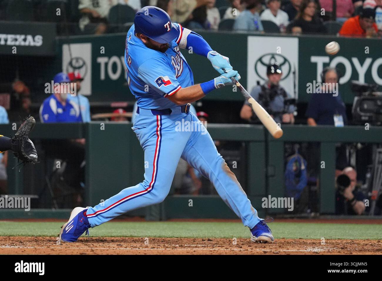 Texas Rangers' Jake Burger hits during the sixth inning of a baseball ...