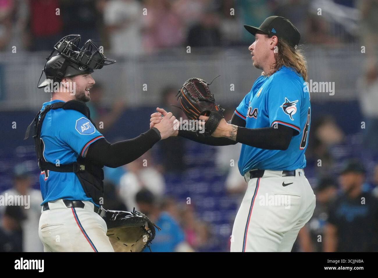 Miami Marlins catcher Liam Hicks and pitcher Lake Bachar celebrate ...