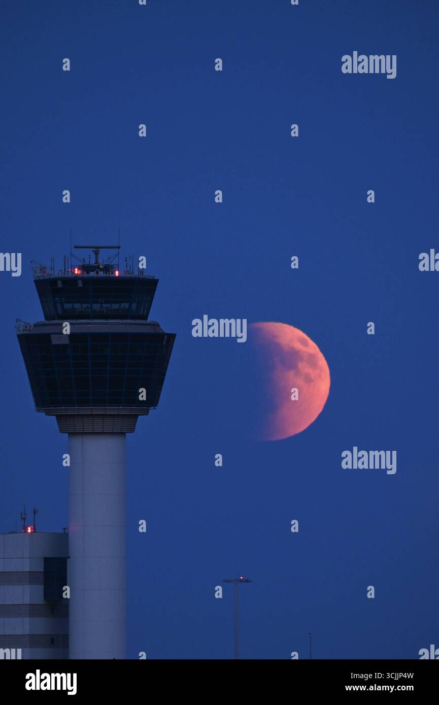 Total lunar eclipse unfolds over the Air Traffic Control Tower at ...