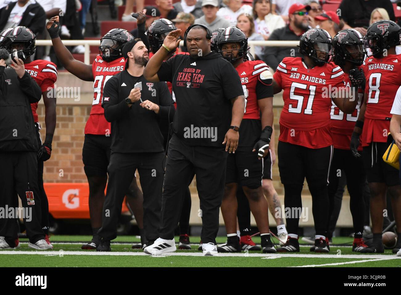 Texas Tech defensive line coach Zarnell Fitch watches on the sideline ...
