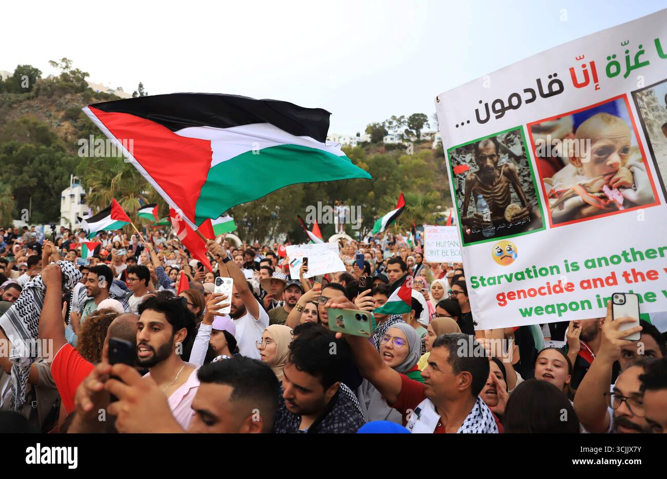 People chant in support of the the Global Sumud Flotilla as it arrives ...