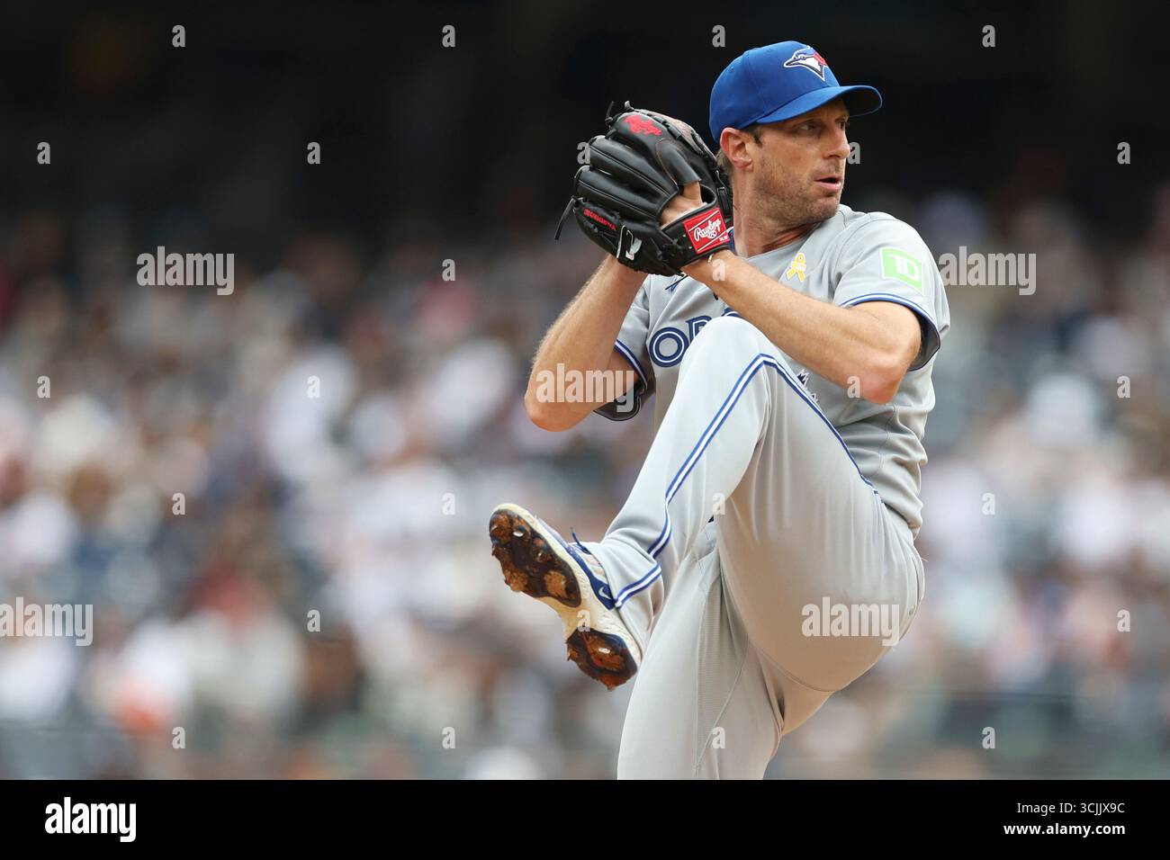 Toronto Blue Jays pitcher Max Scherzer winds up to throw during the ...