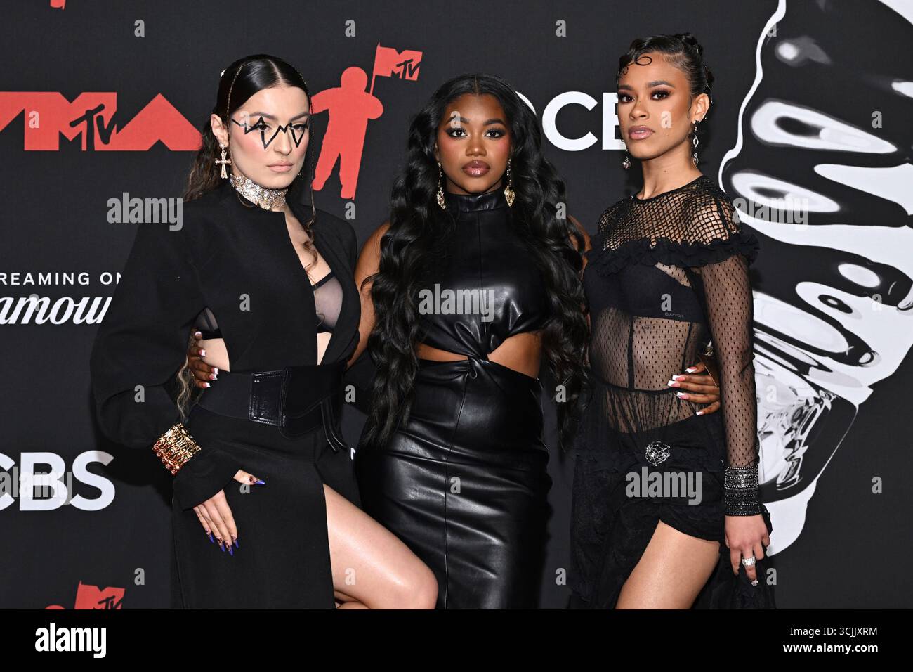 Brianna Mazzola, from left, Nori Moore and Wennely Quezada of 3Quency arrives at the MTV Video ...