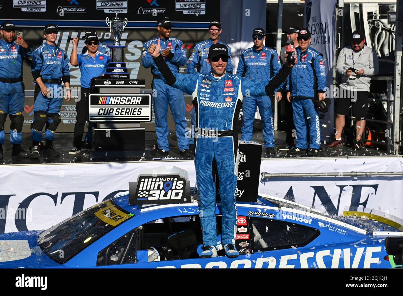 Denny Hamlin, center, celebrates after winning a NASCAR Cup Series auto ...