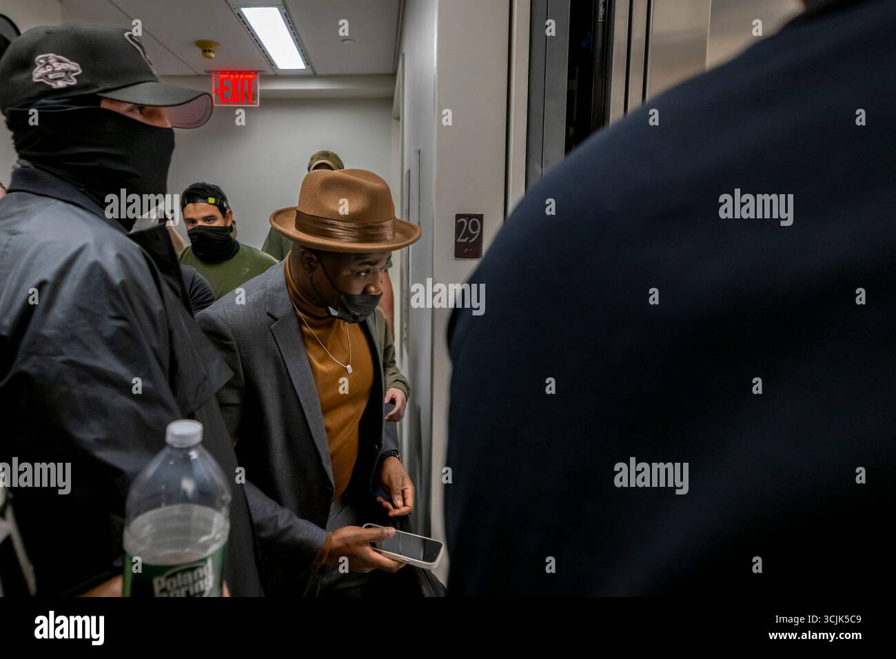 Federal agents detain an individual as he exits immigration court at ...