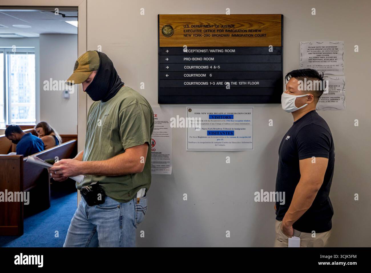 Federal agents patrol the halls of immigration court at the Jacob K ...