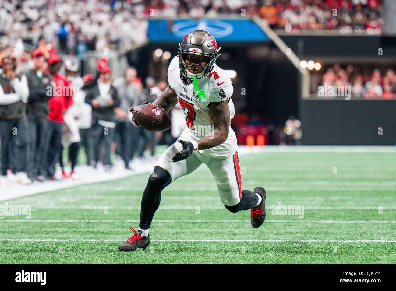 Tampa Bay Buccaneers running back Bucky Irving (7) runs the ball ...