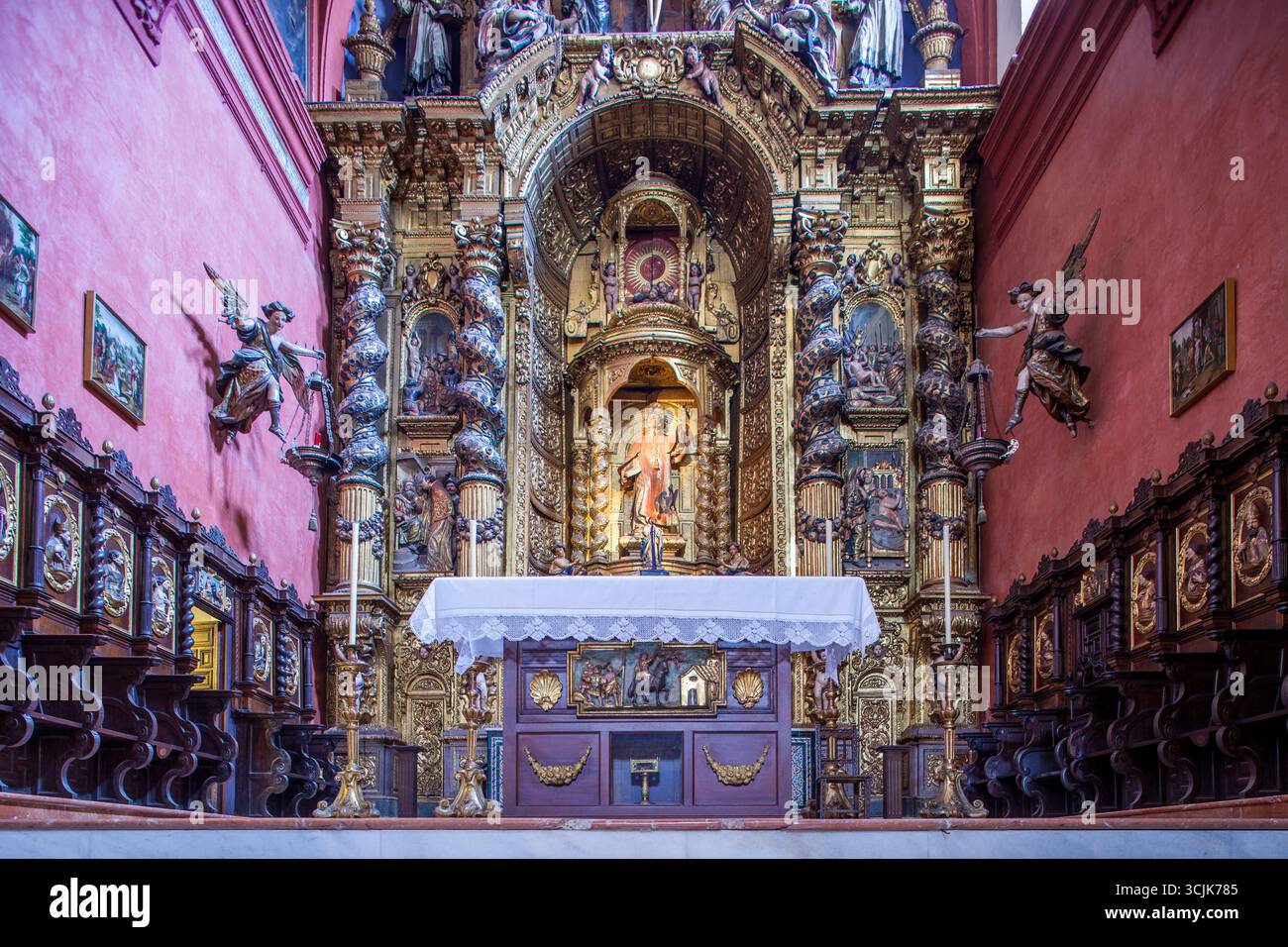 The main altar, a baroque marvel, displays intricate gold details ...