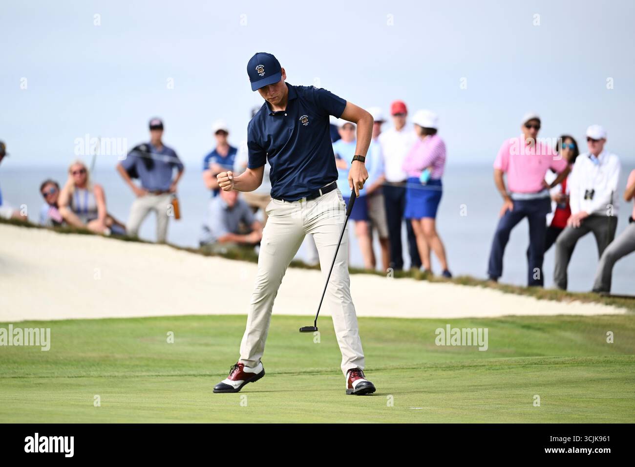 The USA team's Mason Howell reacts after making a putt on the 13th ...