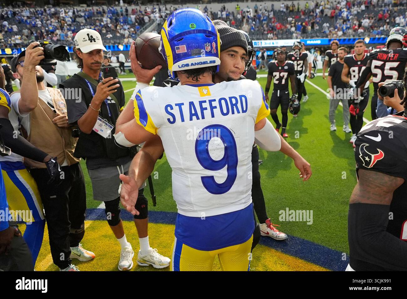 Los Angeles Rams quarterback Matthew Stafford (9) hugs Houston Texans ...