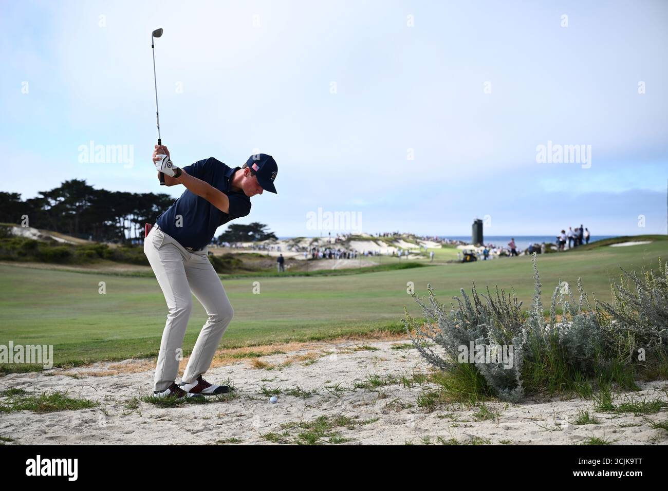 The USA team's Mason Howell hits off a fairway bunker during Walker Cup ...