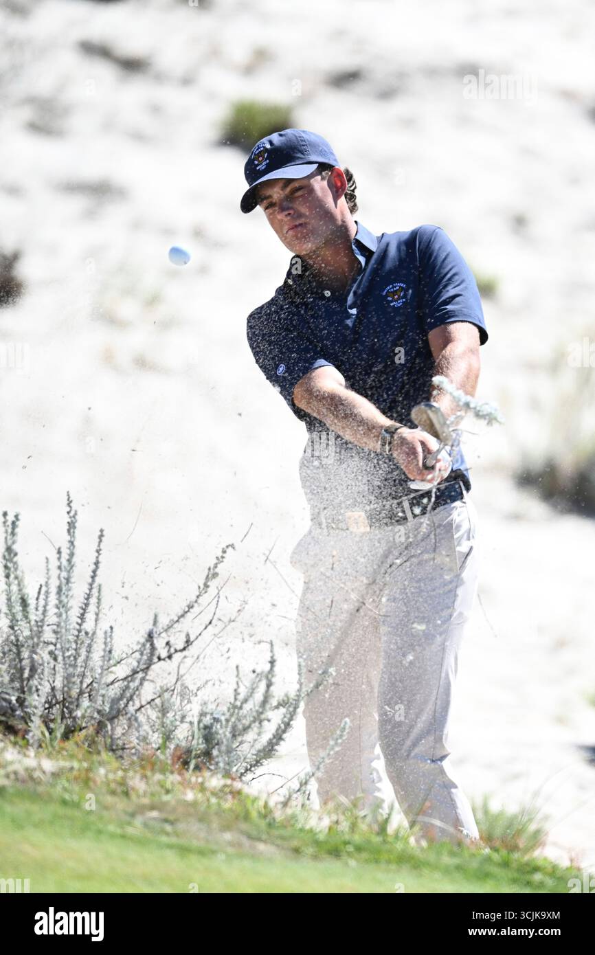 The USA team's Jackson Koivun hits from a bunker on the ninth hole during Walker Cup golf ...