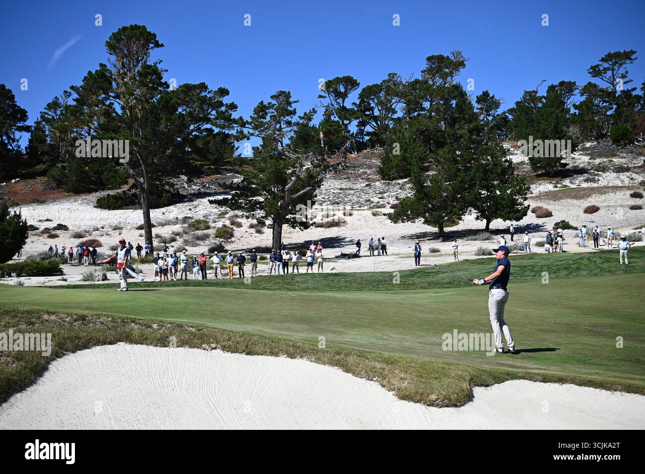 The USA team's Mason Howell takes his approach shot off the sixth green ...