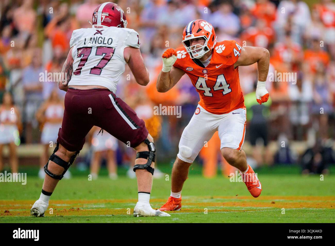Troy offensive lineman Garner Langlo (77) blocks Clemson defensive end ...