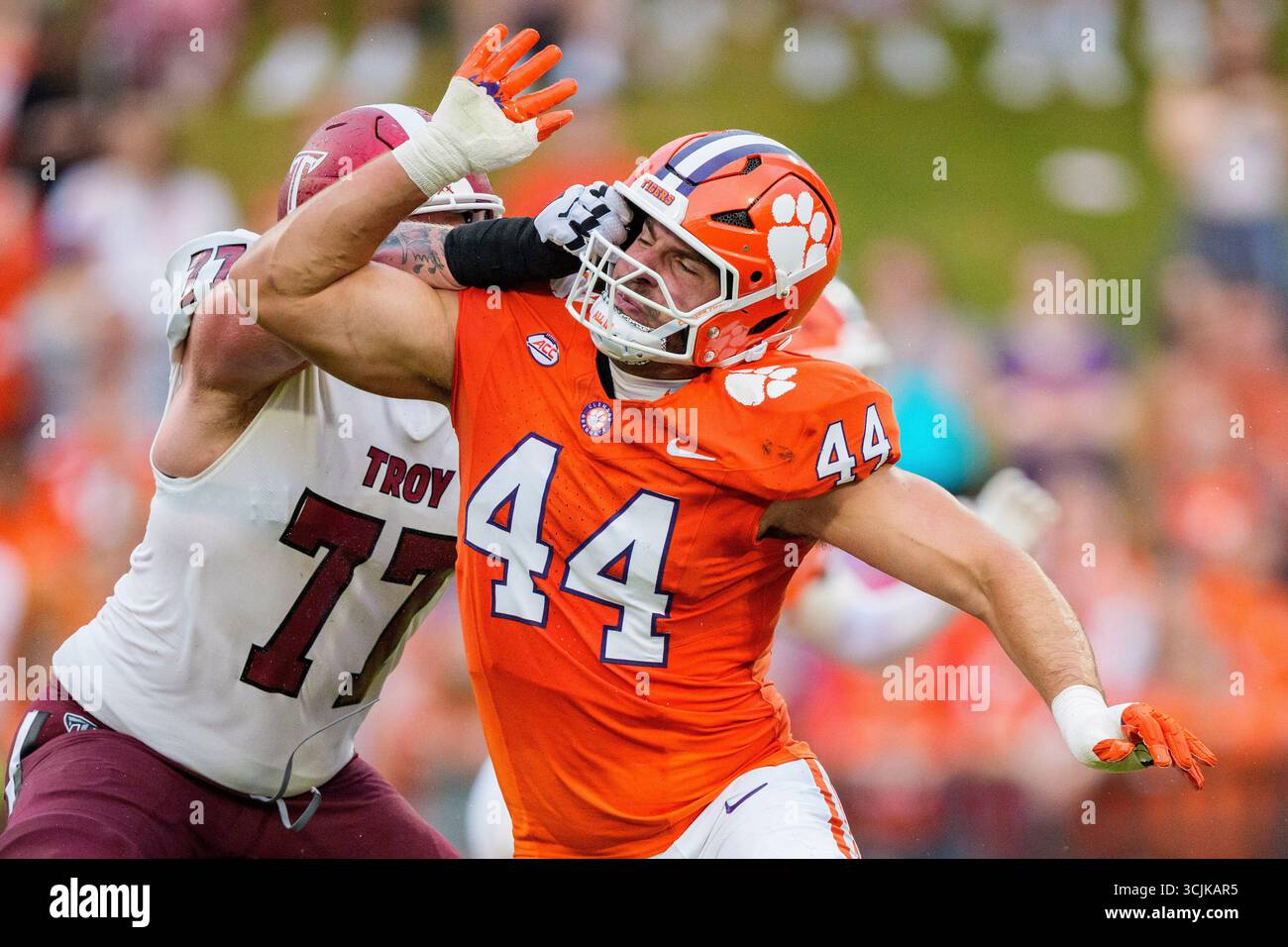 Troy offensive lineman Garner Langlo (77) blocks Clemson defensive end ...