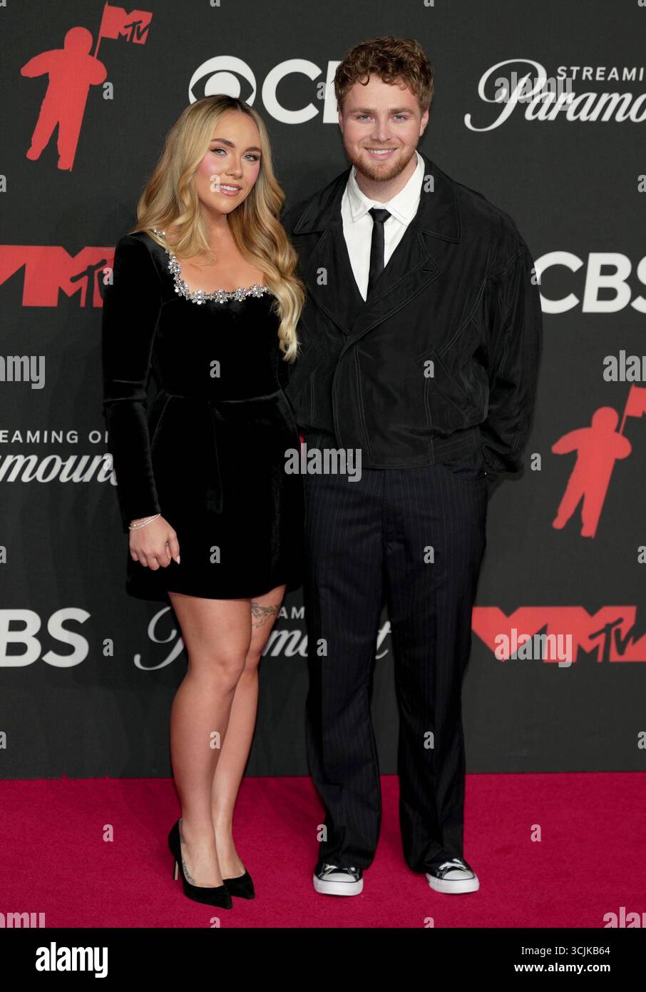Alex Warren (R) arrives on the red carpet at the 2025 MTV Video Music ...