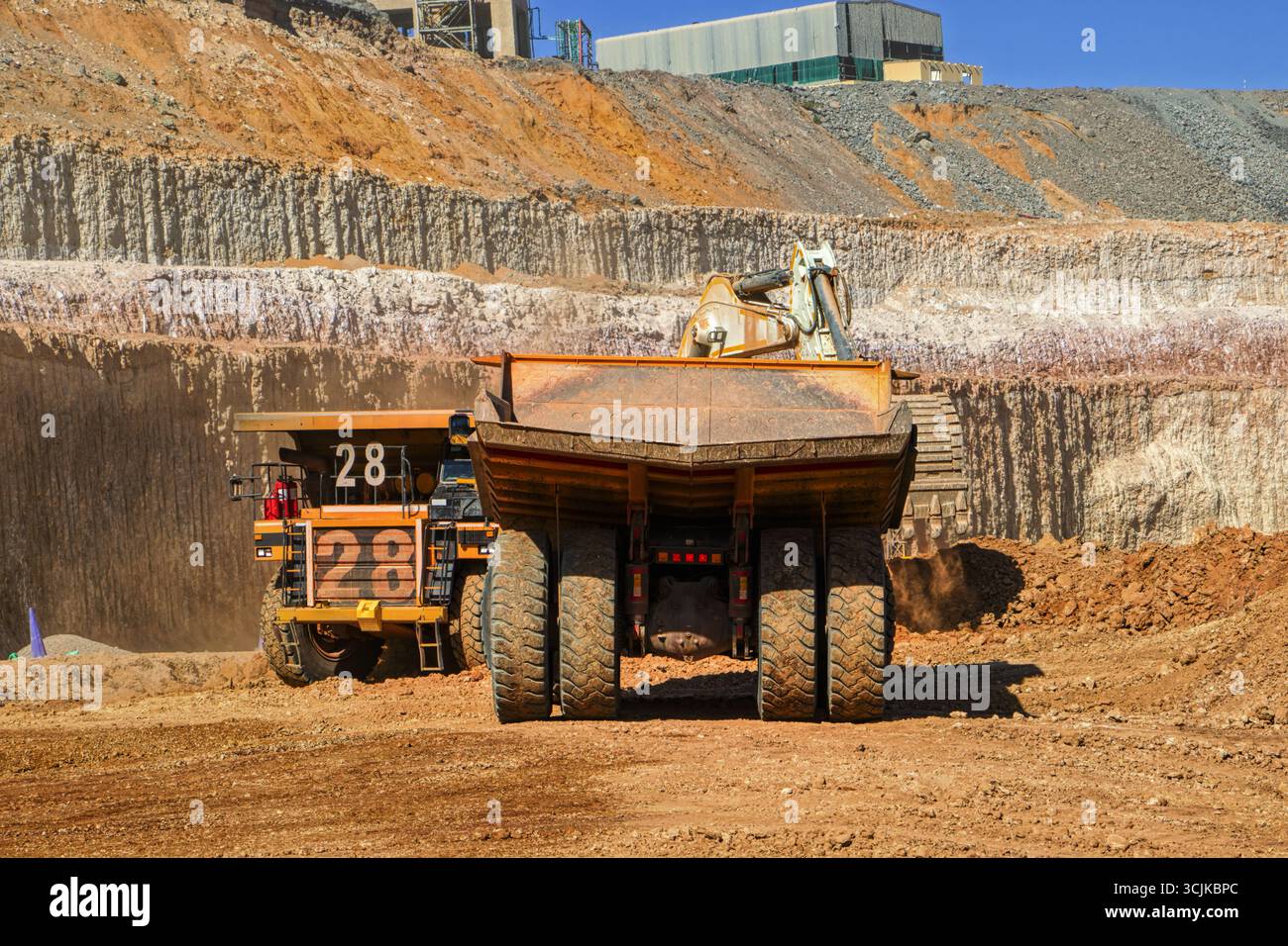 trucks getting loaded with kimberlite, excavator, open pit mine, large ...