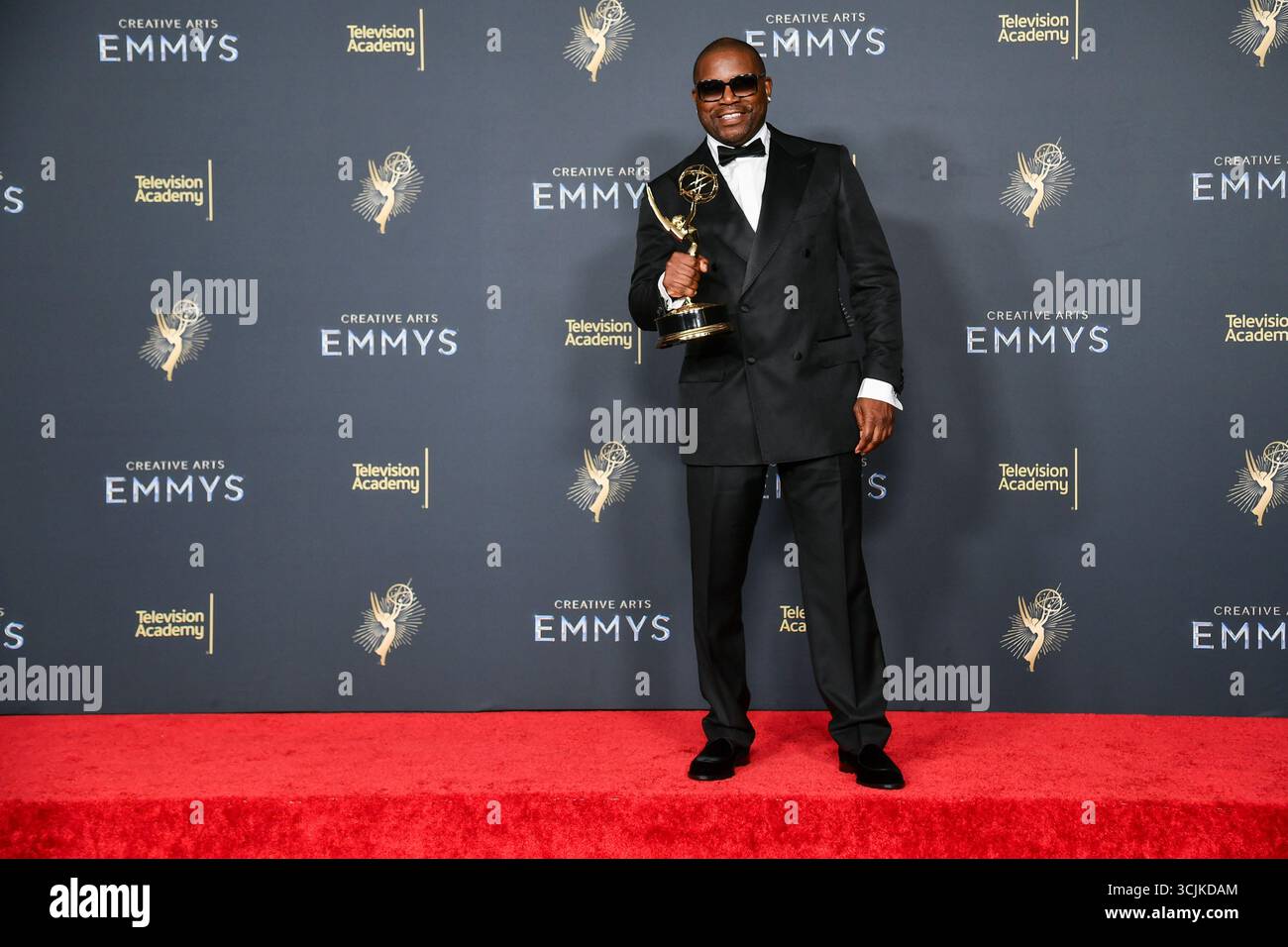 Tony Russell poses in the press room with the award for music direction ...