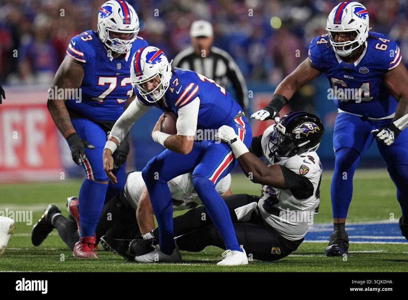 Buffalo Bills quarterback Josh Allen (17) is tackled by Baltimore ...