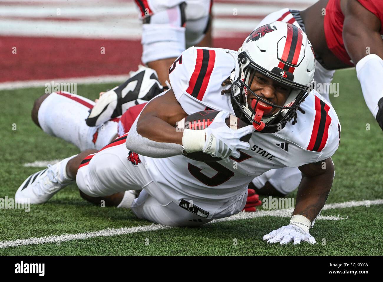 Arkansas State running back Kenyon Clay (5) is tackled by an Arkansas ...