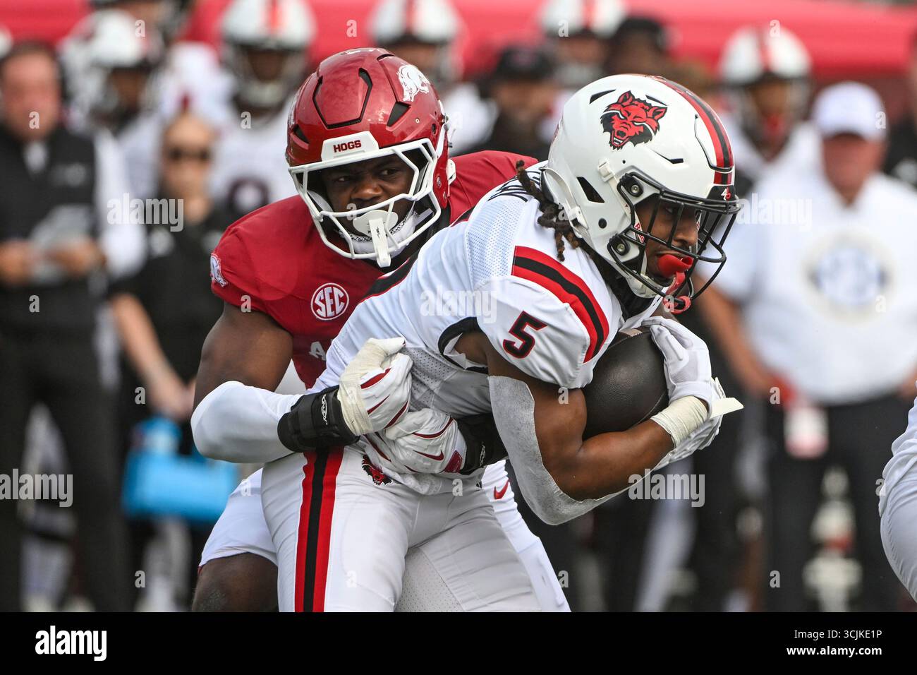 Arkansas defensive lineman Phillip Lee (1) tackles Arkansas State ...