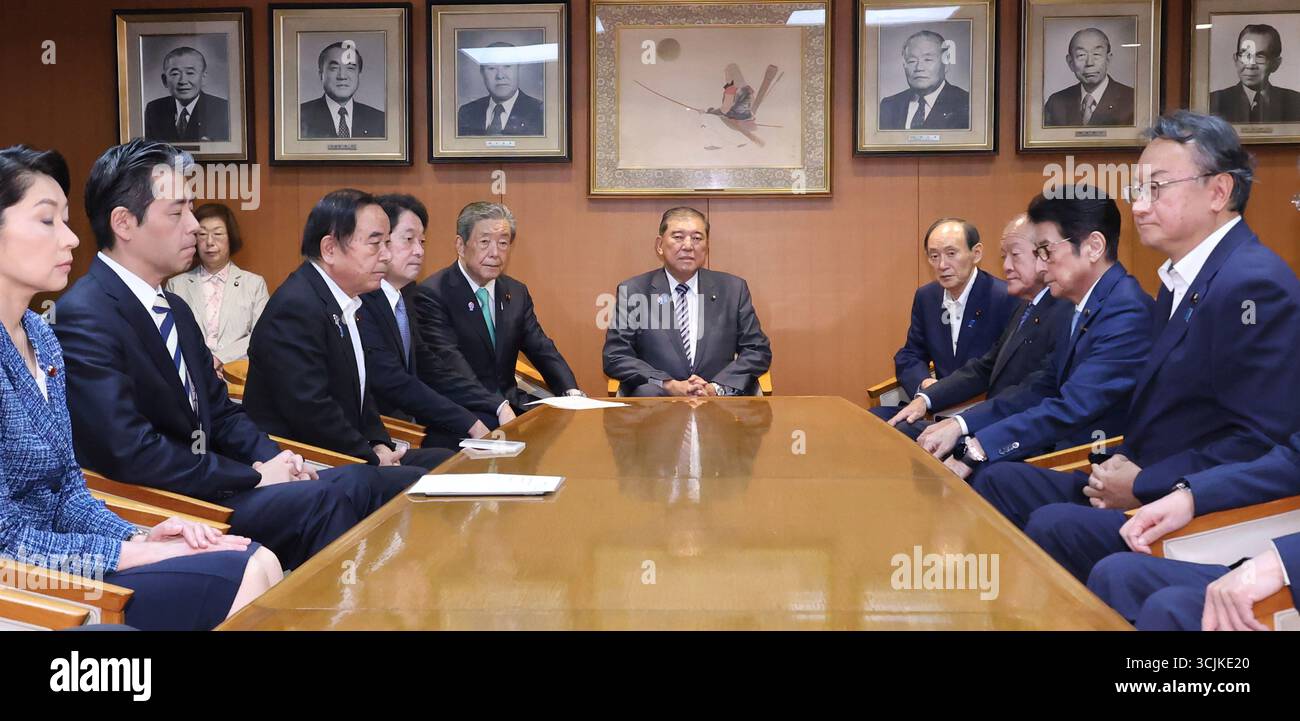 Japanese Prime Minister Shigeru Ishiba (C) attends an extraordinary of ...