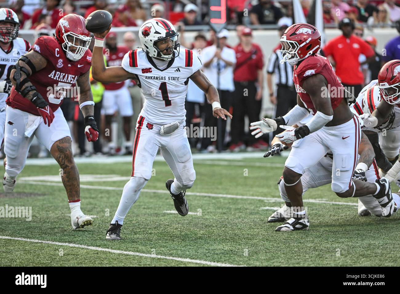 Arkansas State quarterback Jaylen Raynor (1) scrambles out of the ...