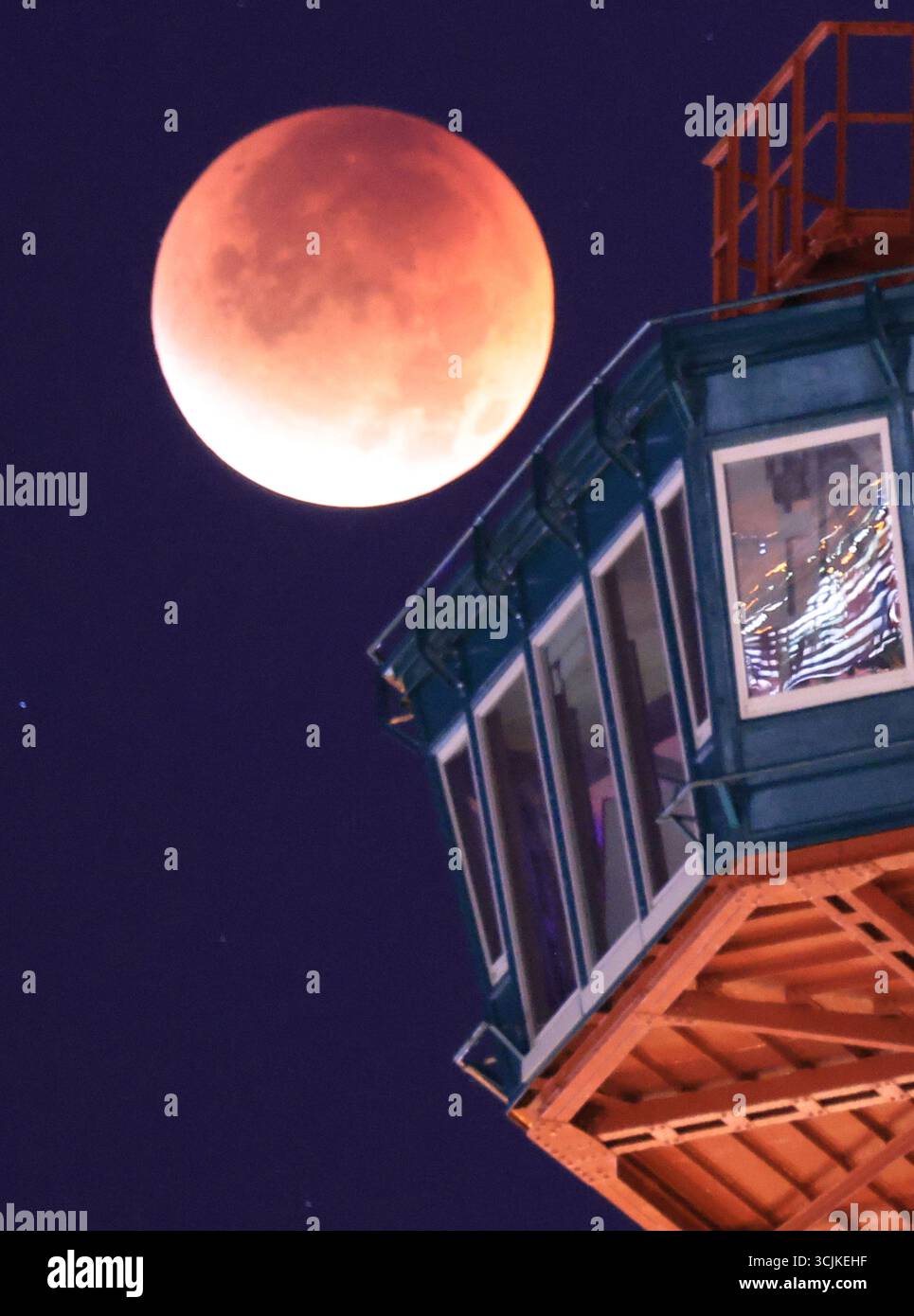 A total lunar eclipse is observed beside the Sapporo TV Tower in Sapporo City, Hokkaido ...