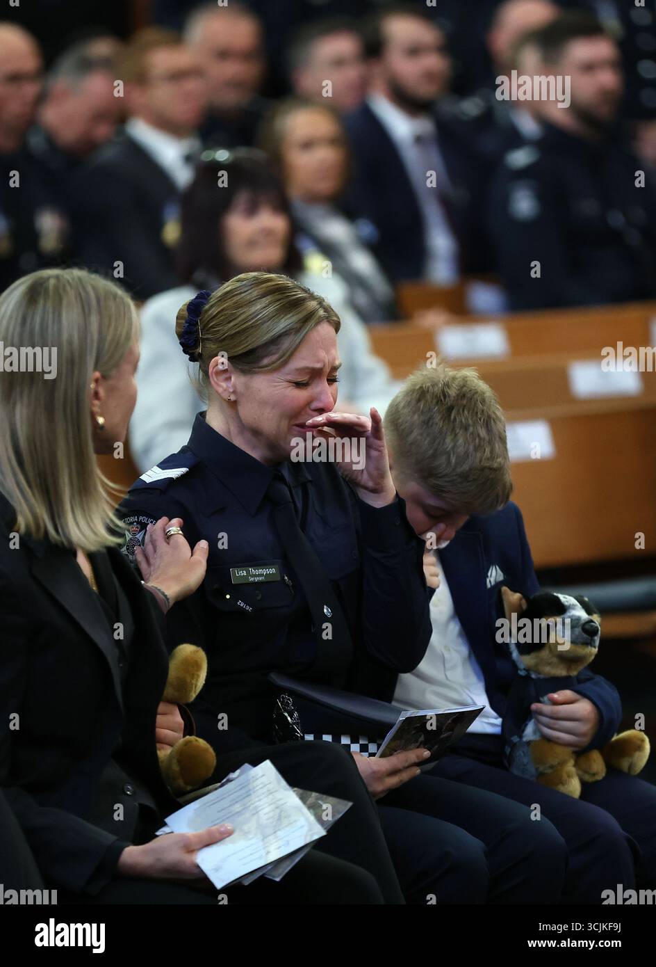 Sergeant Lisa Thompson, partner of Neal Thompson, reacts during the ...
