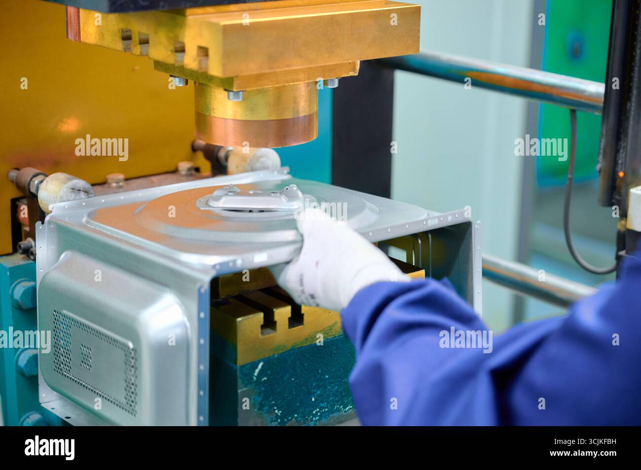 Spot welding process taking place on microwave oven casing in a ...