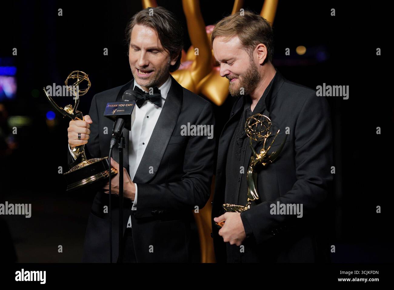 EXCLUSIVE - David Bertok, from left, and Duncan Thum with their Emmy ...