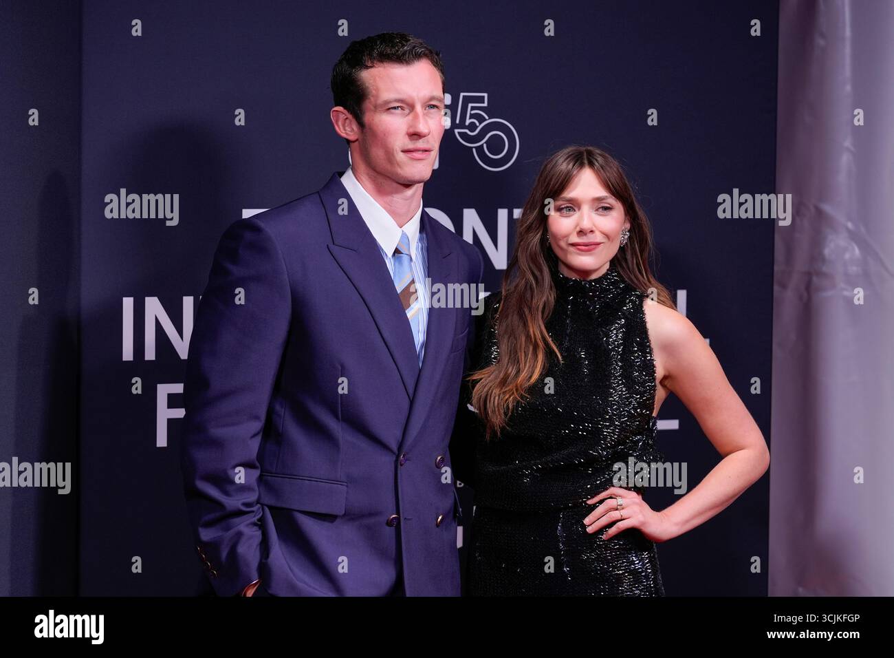 Callum Turner, left, and Elizabeth Olsen attend the premiere of ...