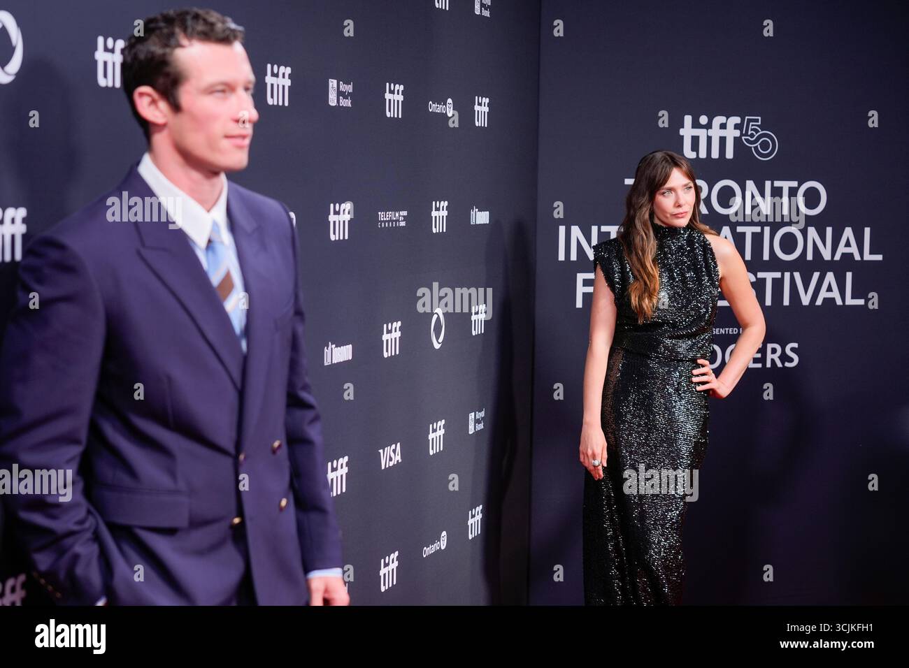 Callum Turner, left, and Elizabeth Olsen attend the premiere of ...