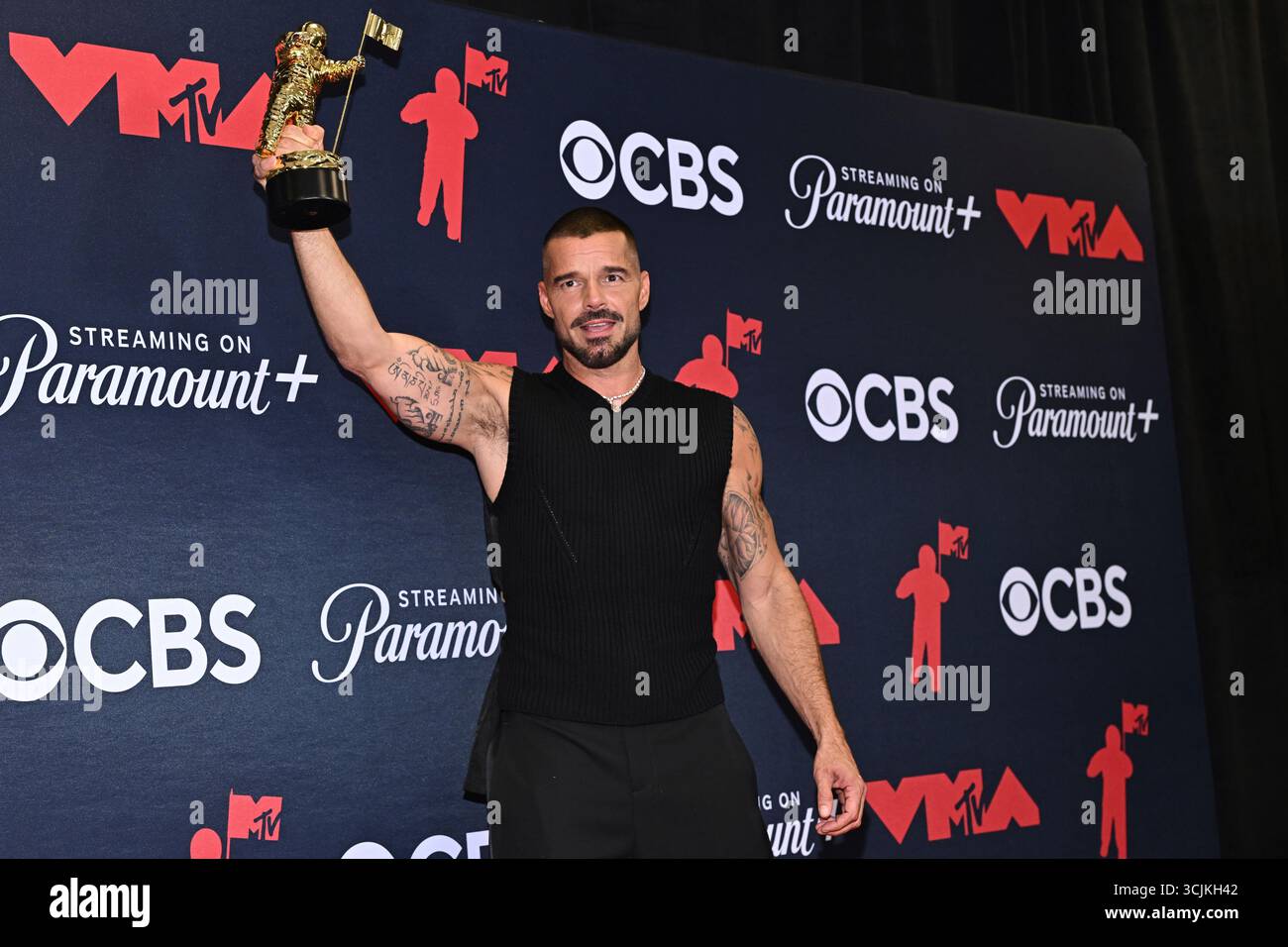 Ricky Martin, winner of the latin icon award, poses in the press room ...